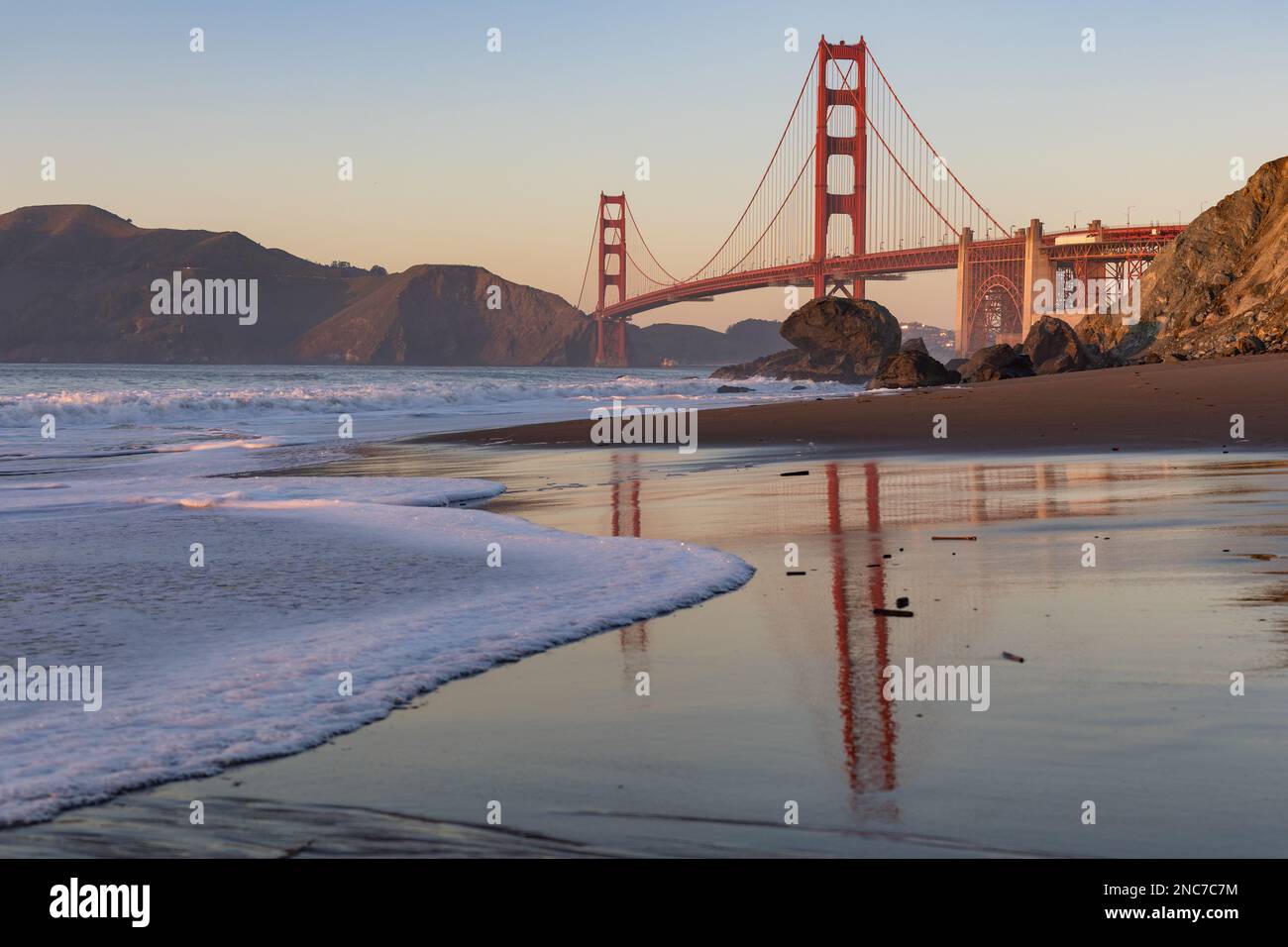 Marshall's Beach at sunset with the Golden Gate Bridge in the distance ...