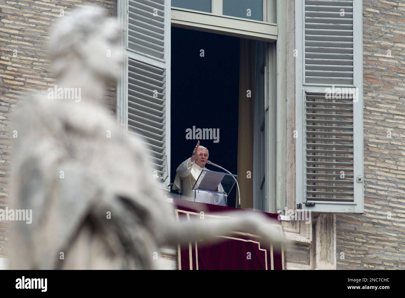 Pope Benedict XVI delivers his blessing during the Angelus noon prayer ...