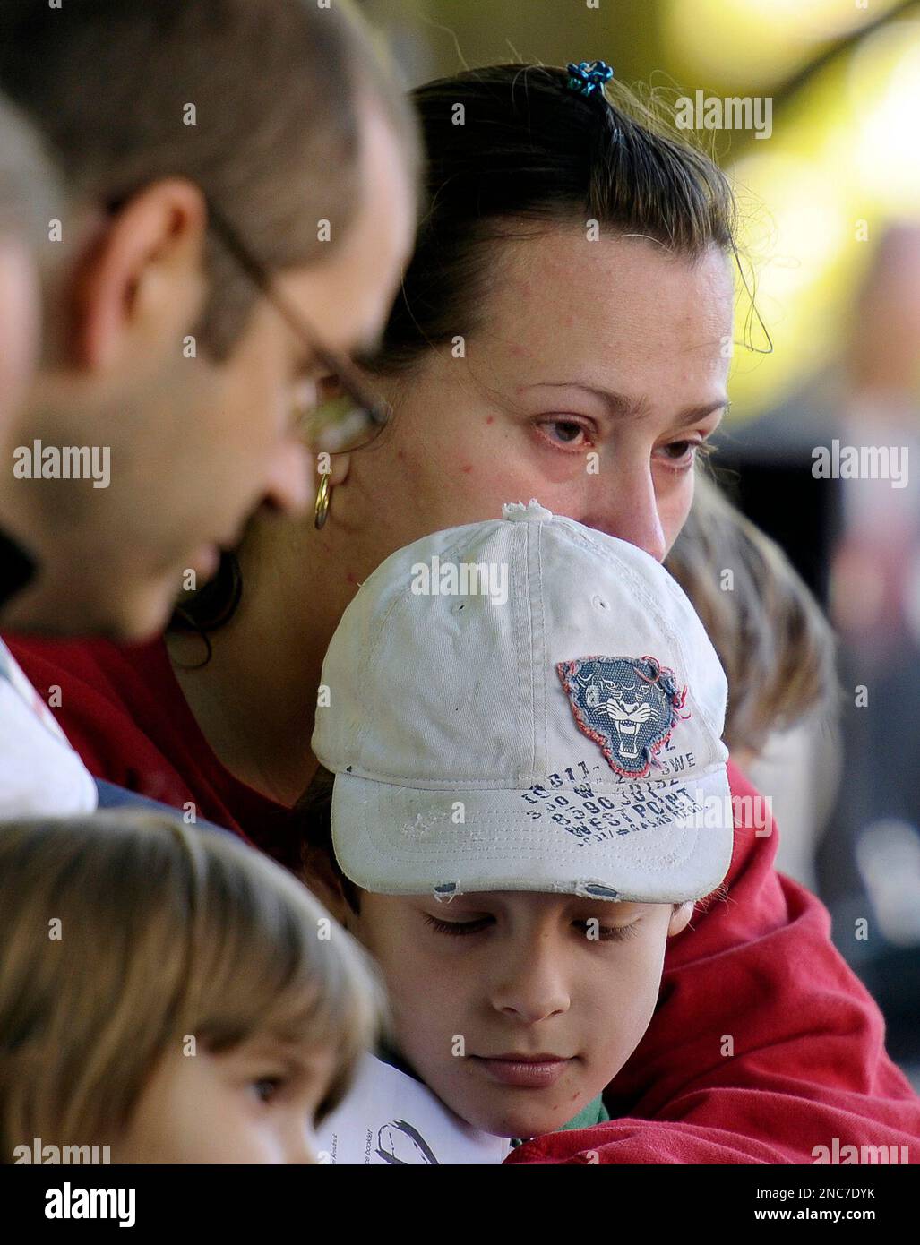 Joanne Fagan-Oslawskyj holds her son Jamie as she attends a church ...