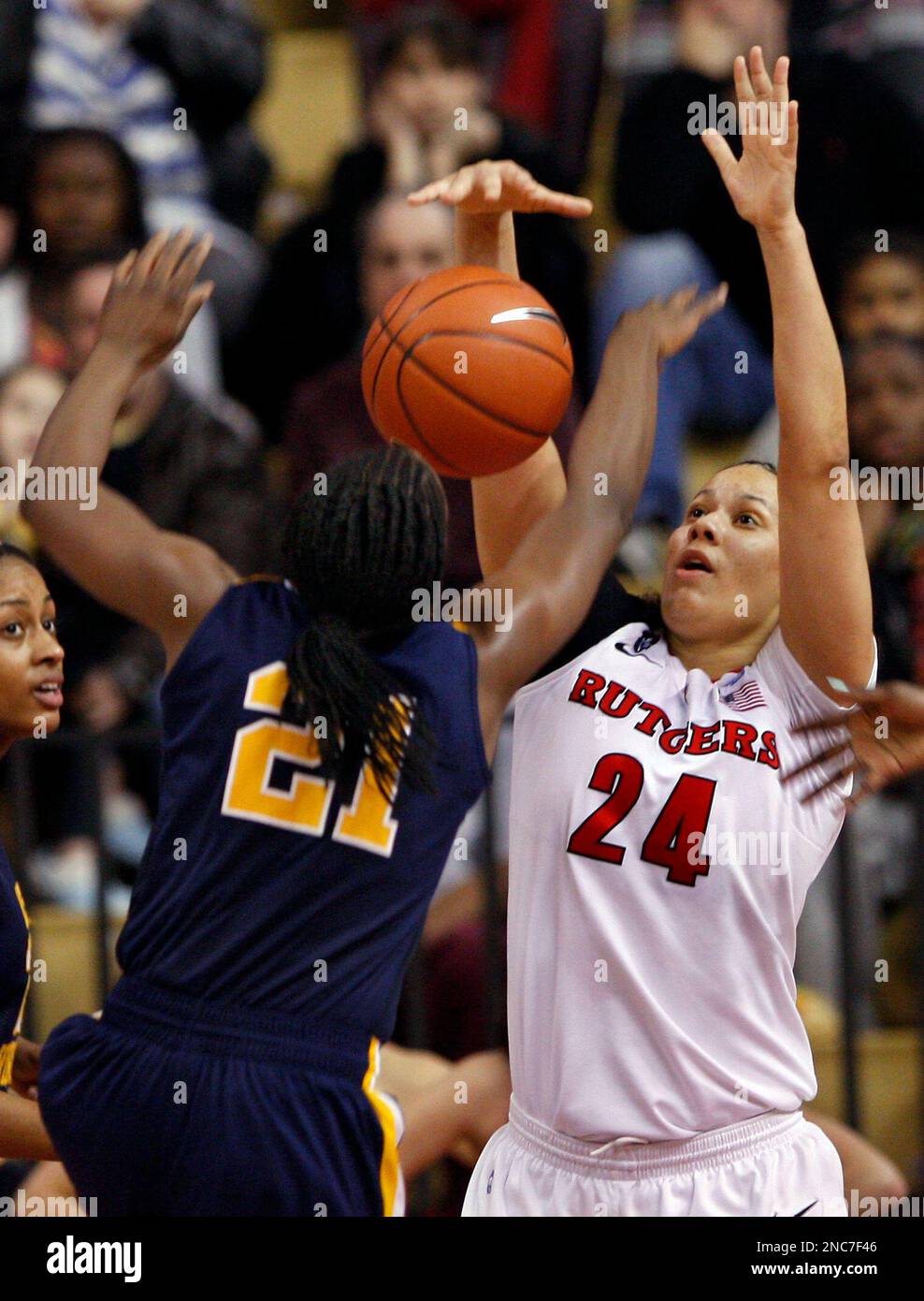 Rutgers' April Sykes (24) blocks a shot by West Virginia's Korinne ...
