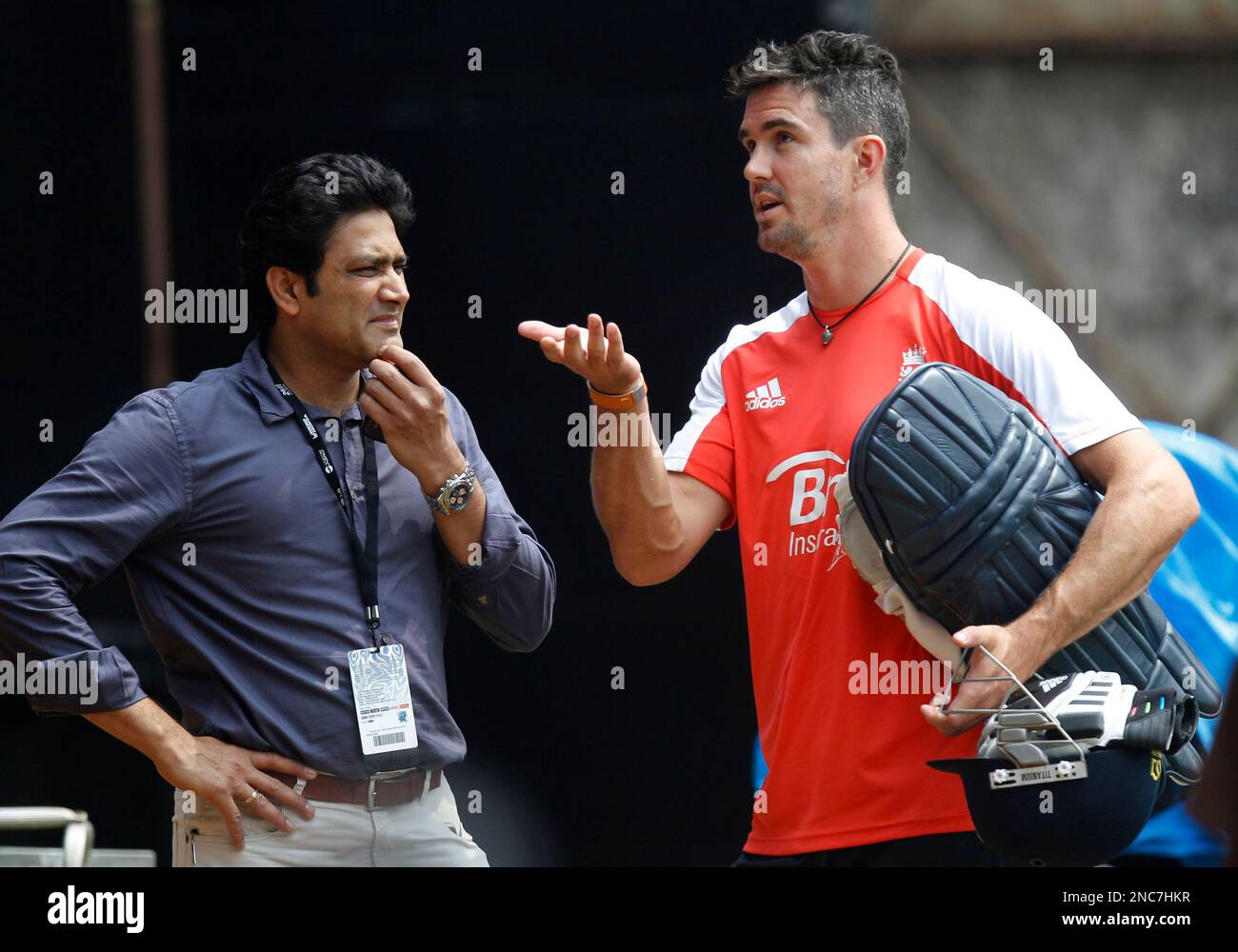 England's Kevin Pietersen talks to former Indian cricket player Anil ...