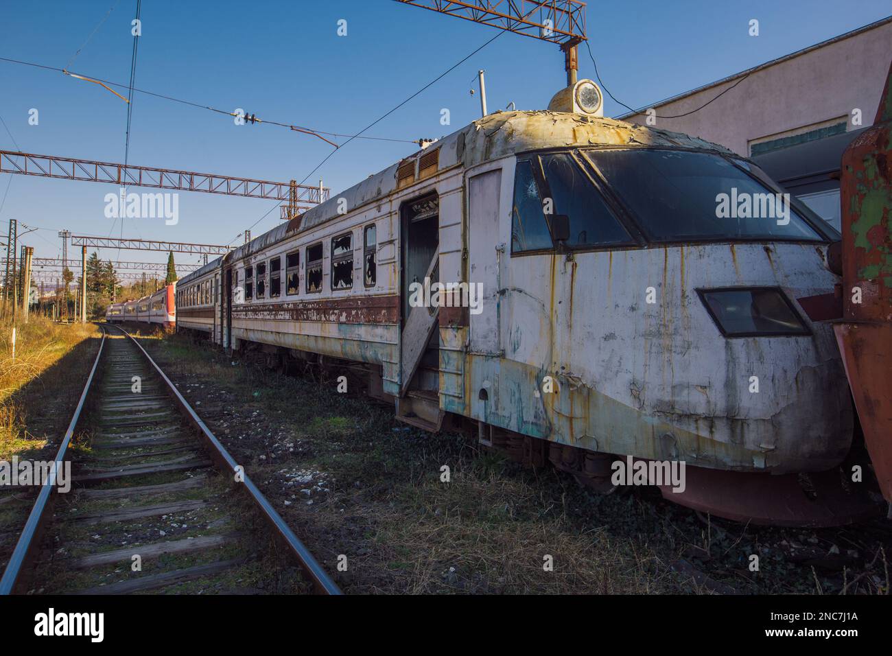 Old abandoned broken high speed train on railway Stock Photo - Alamy