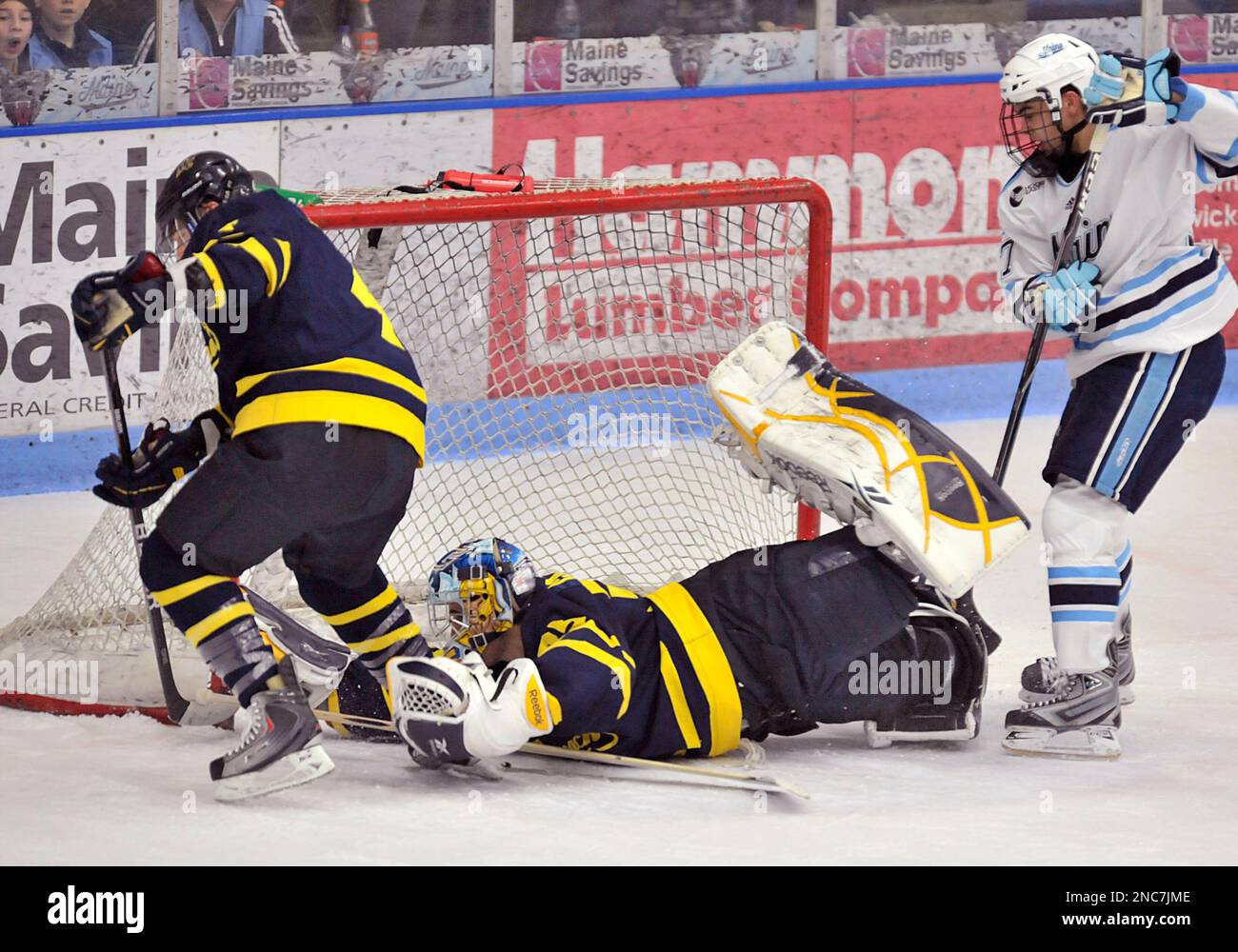 Merrimack defenseman Fraser Allan (2) clears the puck as goalie Joe ...
