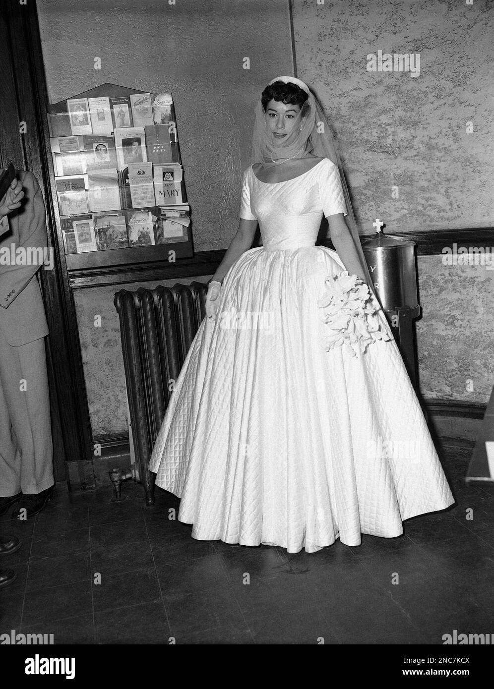 Patrice Munsel, Metropolitan opera star, in her wedding gown in foyer ...