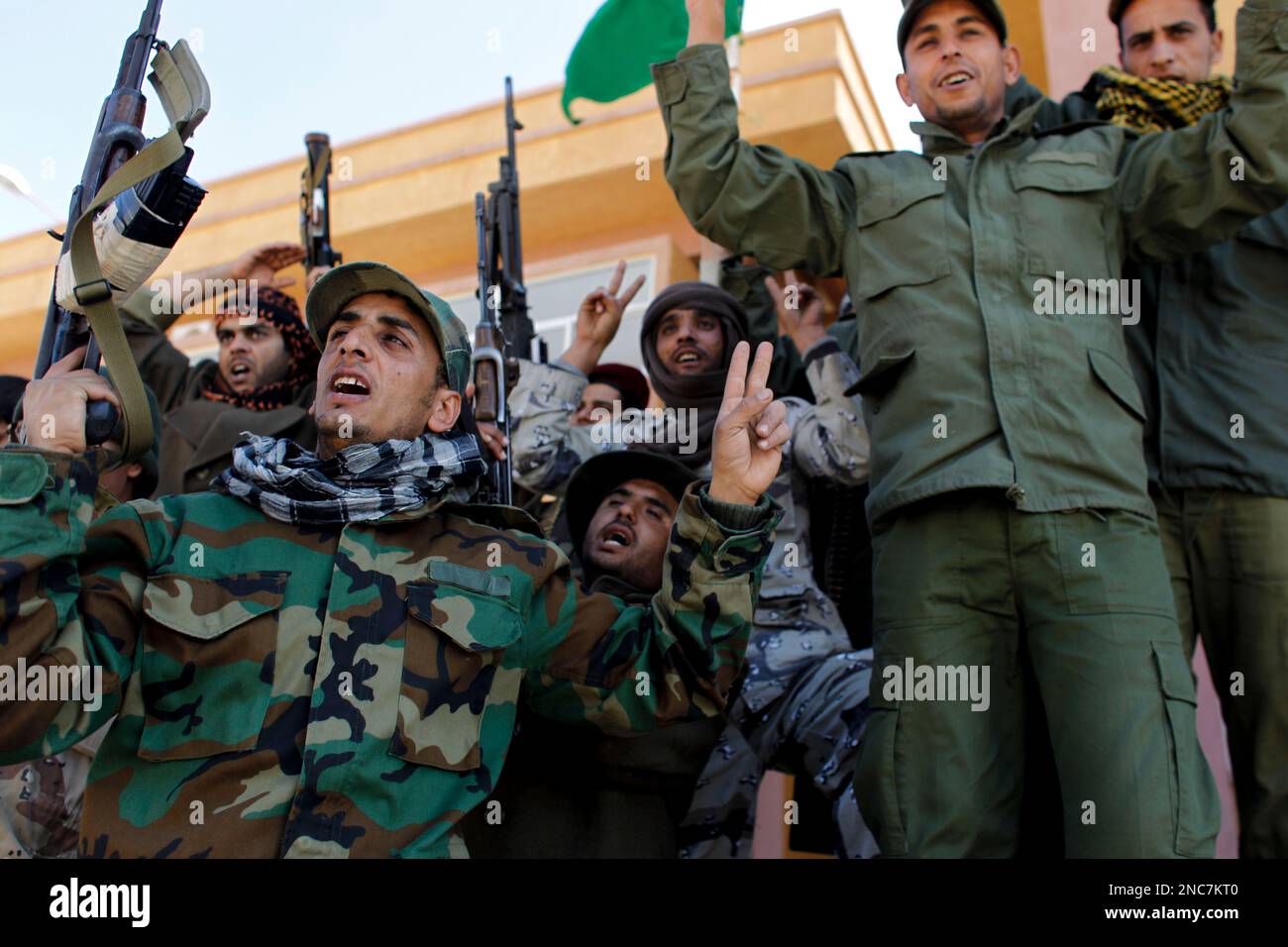 Libyan soilders that now call themselves the Free Libyan Army shout as ...