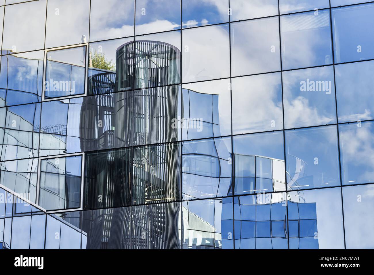 detail of a glass facade of a modern building with reflections Stock ...