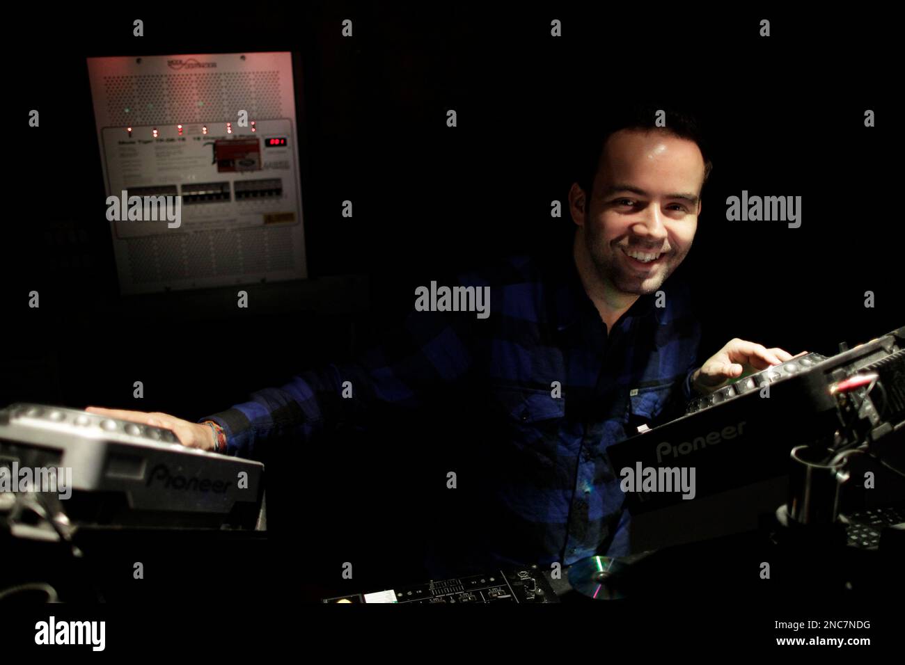In this photo taken Tuesday, Feb. 22, 2011, DJ Sam Young poses for ...