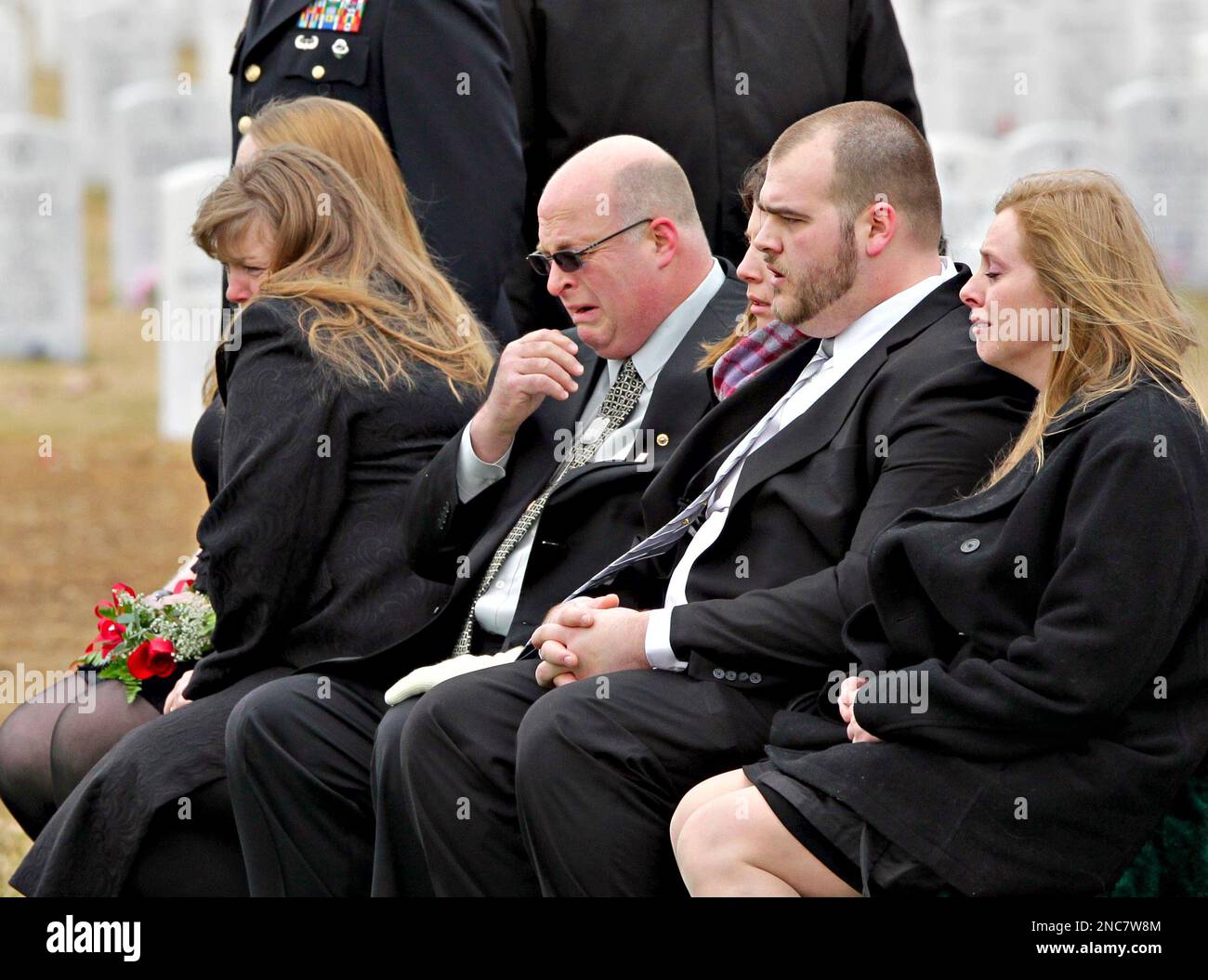 The family of Army Spc. Sean R. Cutsforth attends his funeral service ...