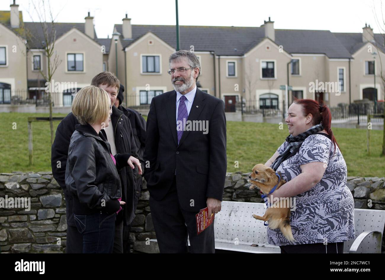 Sinn Fein President Gerry Adams talks to residents while out canvassing ...