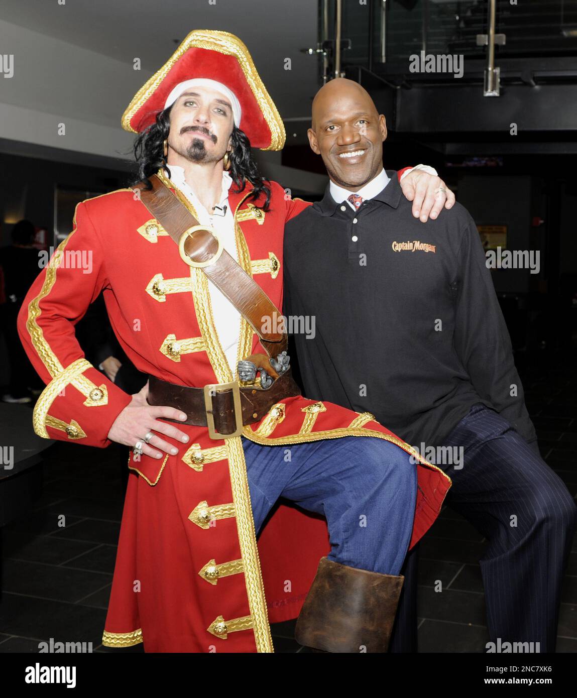 Captain Morgan and Trail Blazers' legend Terry Porter, right, strike a ...