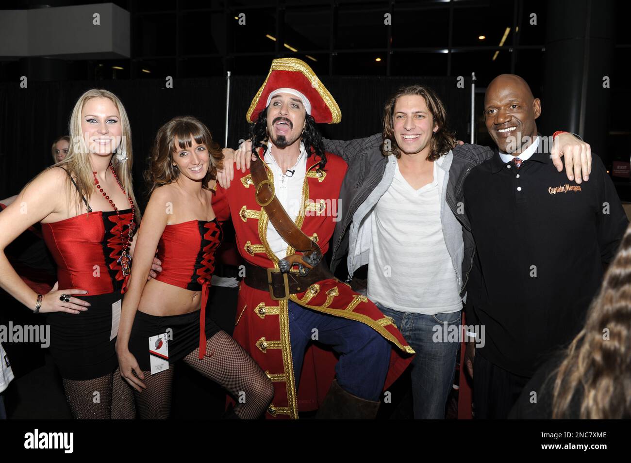 Captain Morgan, center, and Trail Blazers' legend Terry Porter, right ...
