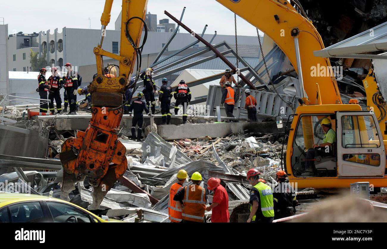 Recovery operation personnel work on the destroyed CTV building in ...