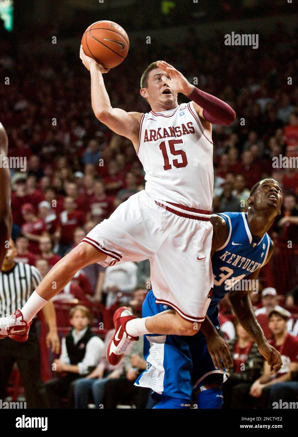 Arkansas' Rotnei Clarke (15) takes a shot as Kentucky's DeAndre Liggins ...