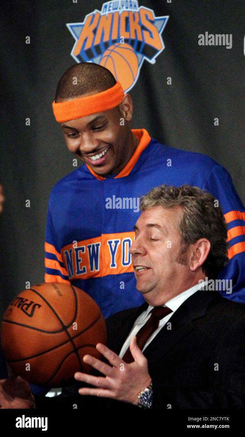 New York Knicks owner James Dolan, bottom, bounces a basketball as he poses for photographs with ...