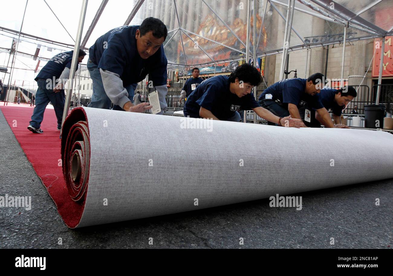 Workers roll out the red carpet for the 83rd Academy Awards outside the ...