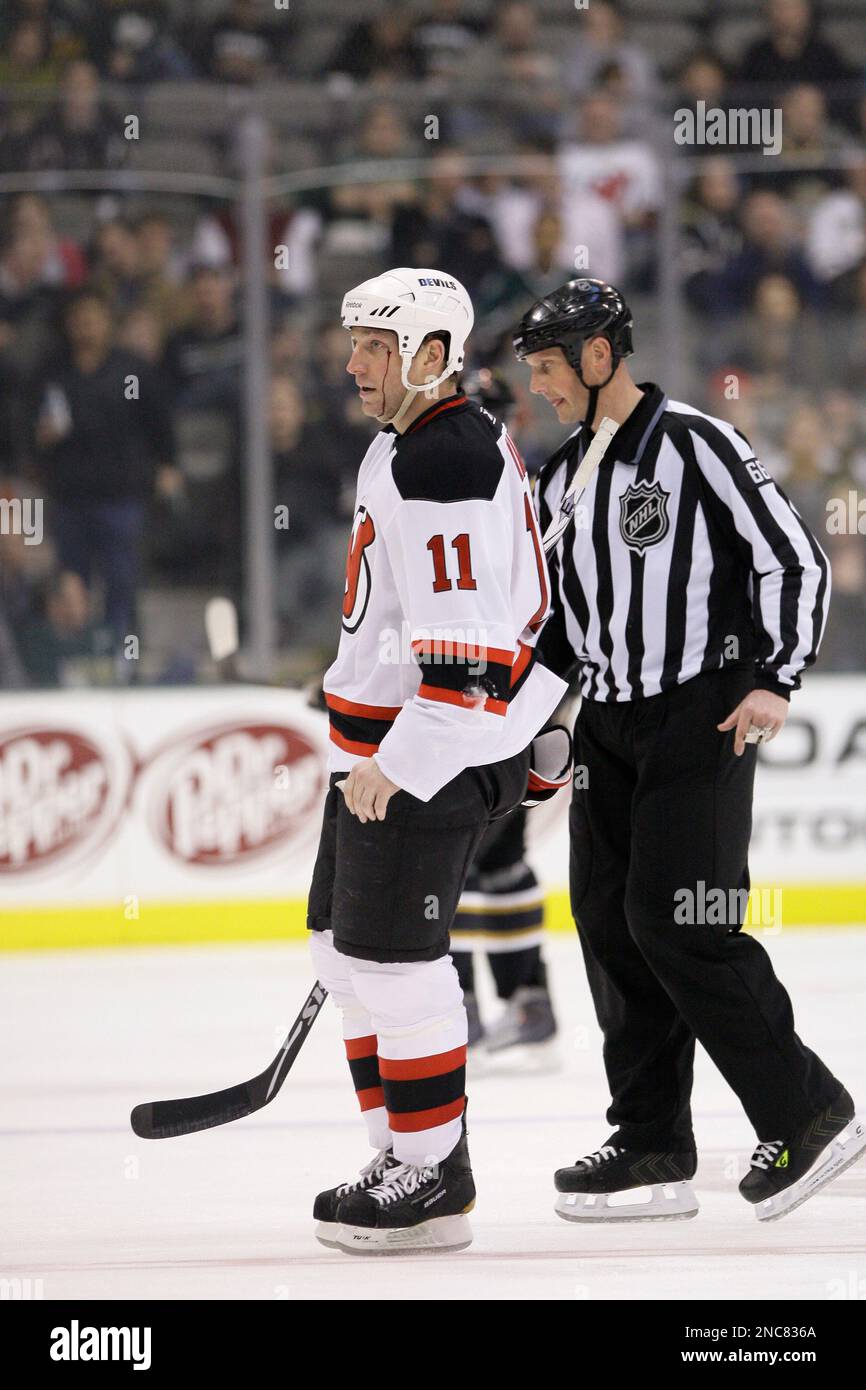 New Jersey Devils center Adam Mair (11) bleeds after suffering an ...