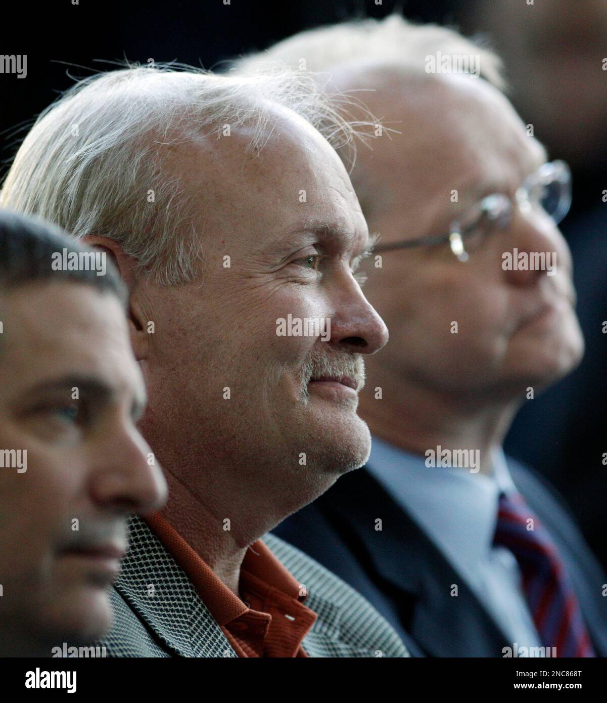 Buffalo Sabres coach Lindy Ruff, center, listens as the team's new ...