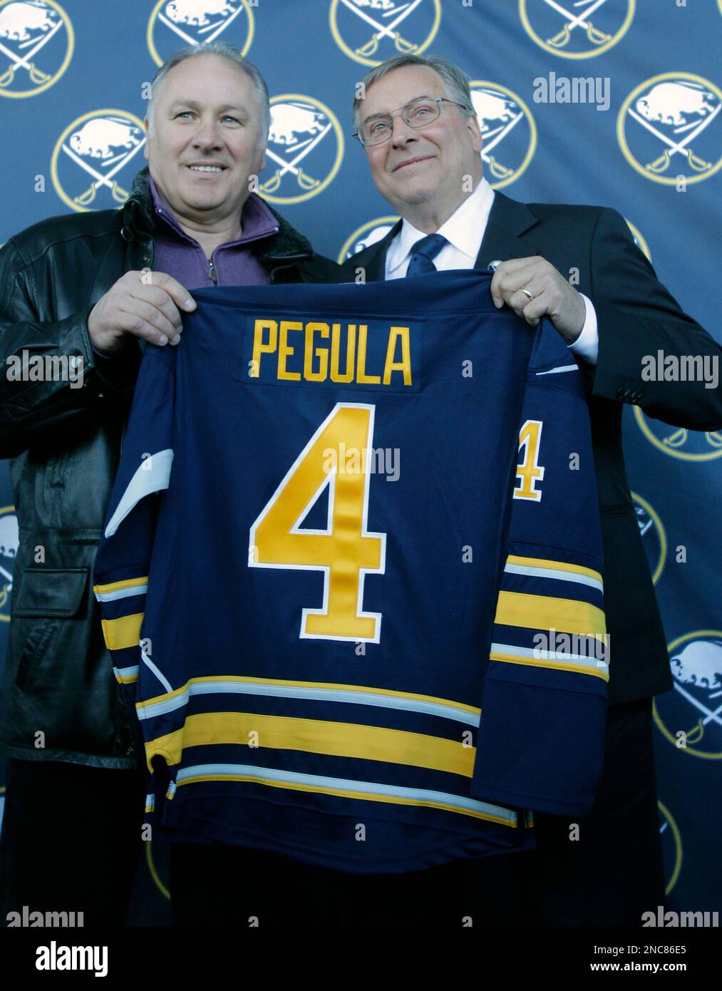 Buffalo Sabres owner Terry Pegula, right, poses for a photo with former ...