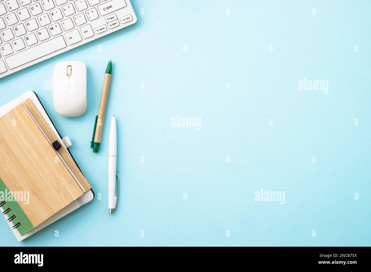 Office table desk with laptop, notepad and pen Stock Photo - Alamy