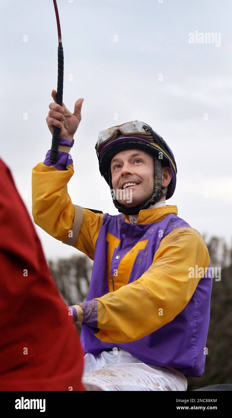 Jockey Jon Court waves to the crowd after winning the $250,000 ...