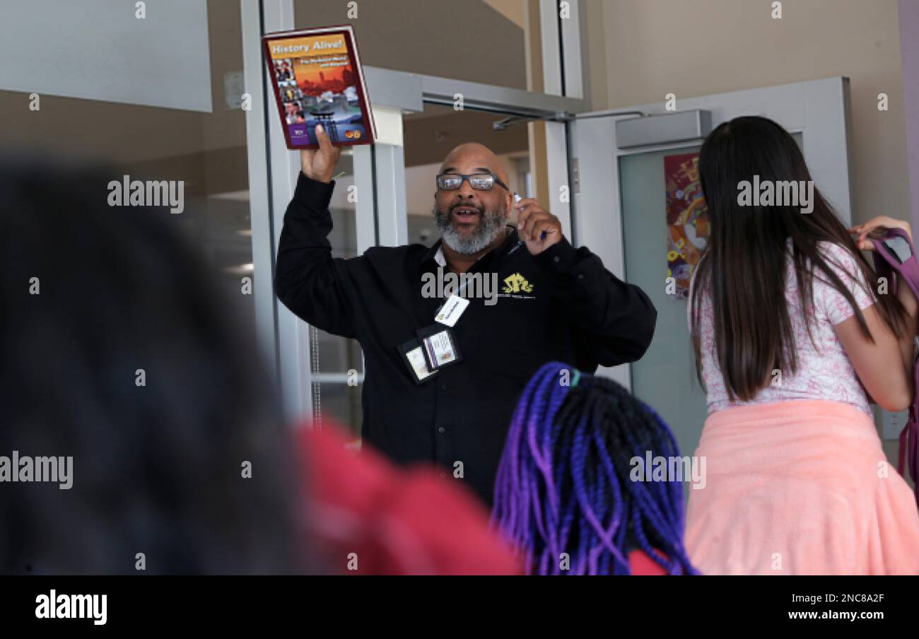 Anthony Sam McNeal gathers the kids together to announce the day's ...
