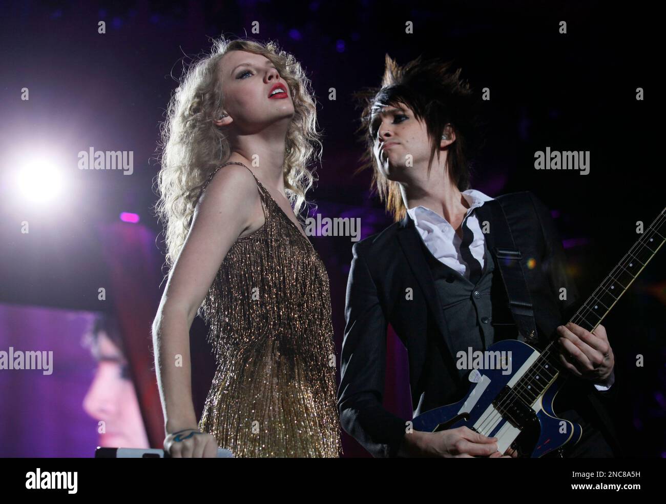 U.S. singer-songwriter Taylor Swift, left performs in Hong Kong as part ...