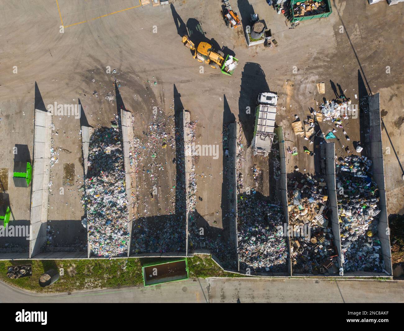 Landfill site, a pile of stinky different junk disposal in the concrete ...