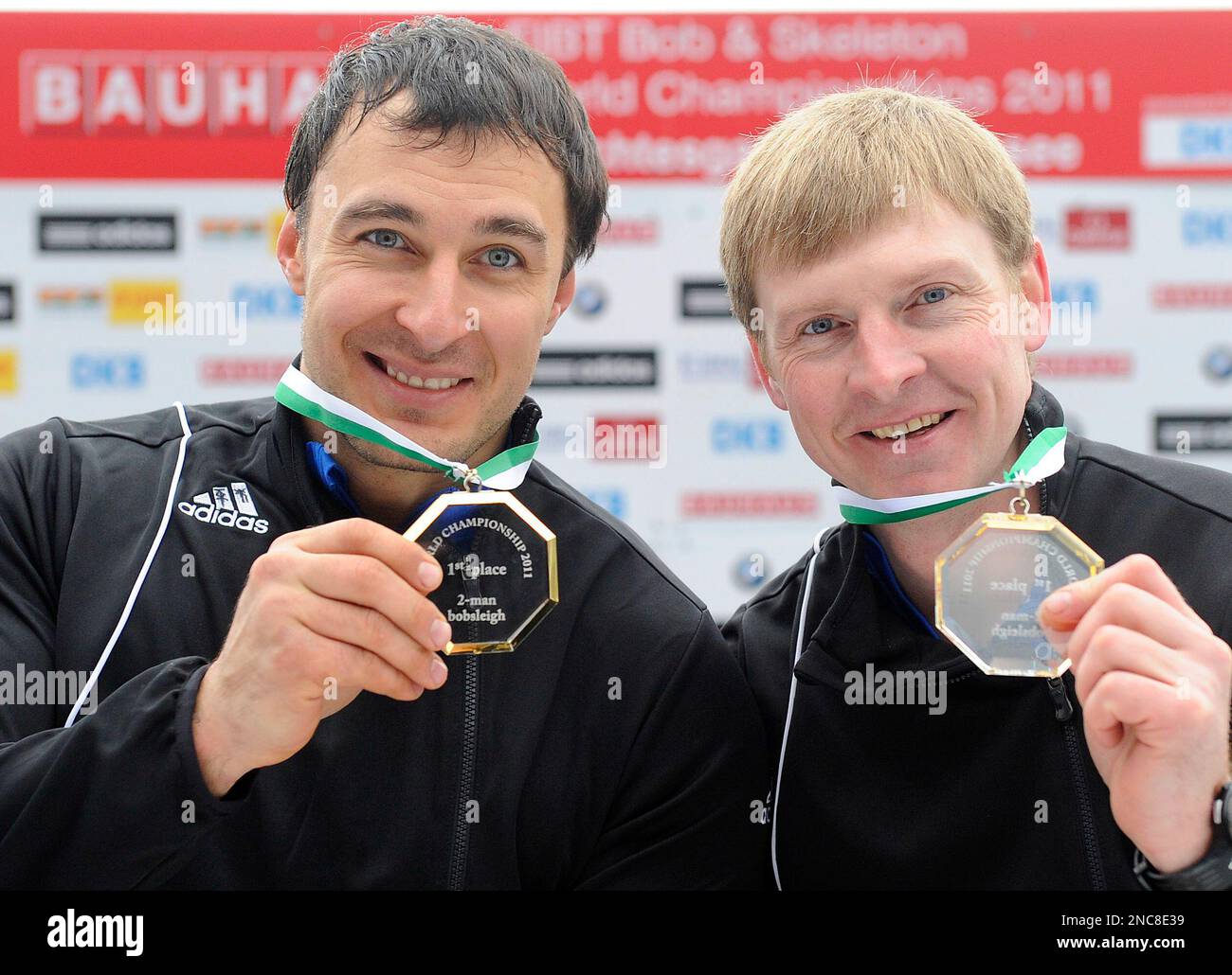 Alexandr Zubkov, right, and Alexey Voevoda from Russia pose with their ...