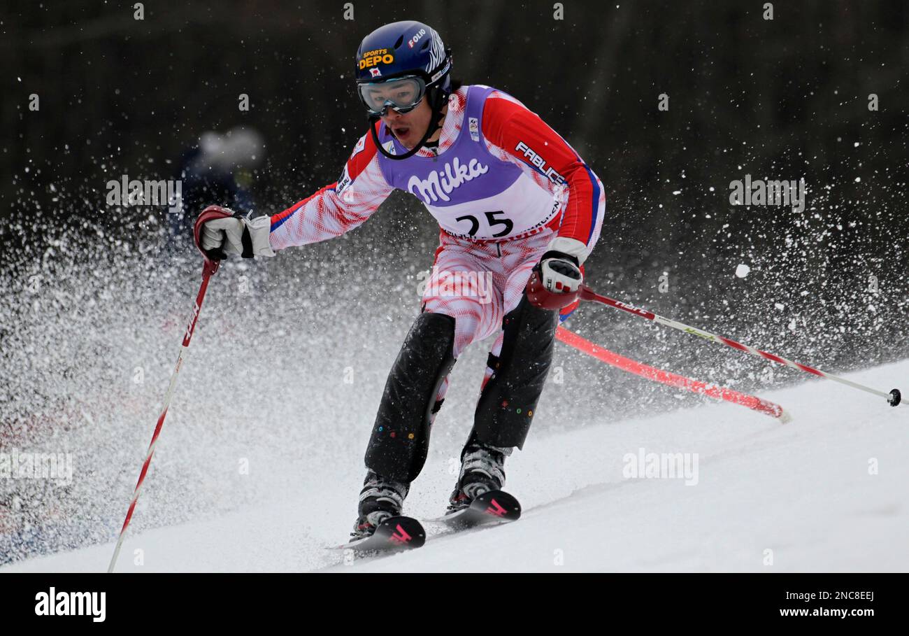 Japan's Naoki Yuasa clears a gate during the first run of the men's slalom, at the Alpine World ...