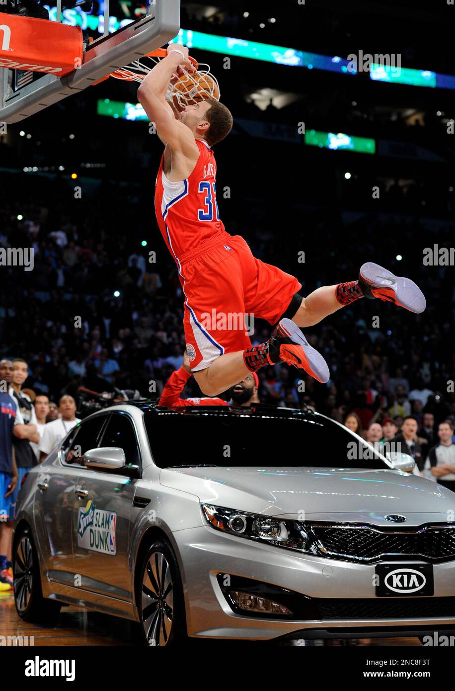 Los Angeles Clippers' Blake Griffin dunks over a car as Baron Davis ...