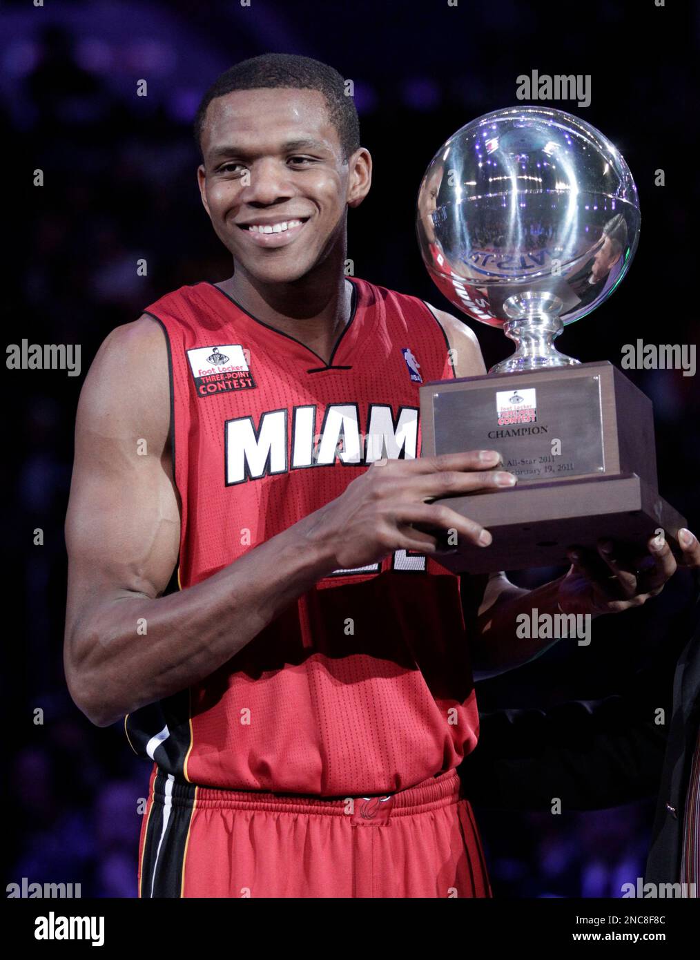 Miami Heat's James Jones holds his trophy after winning the Three-Point ...