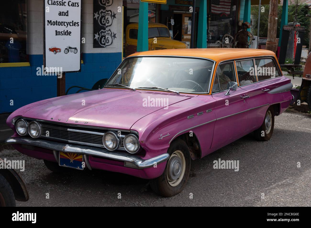 An old pink 1962 Buick Special wagon parked on the street in Seligman ...