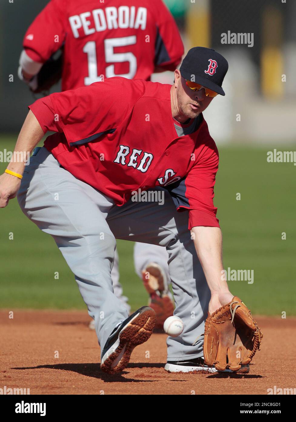 Boston Red Sox infielder Drew Sutton fields a ball on the first day of ...