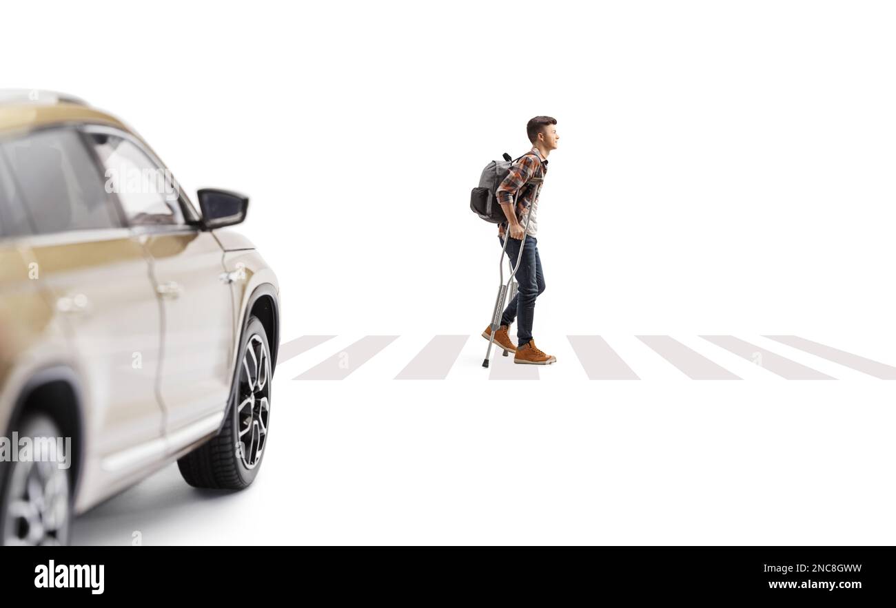Car stopping at a pedestrian crossing and a young man walking with crutches isolated on white ...