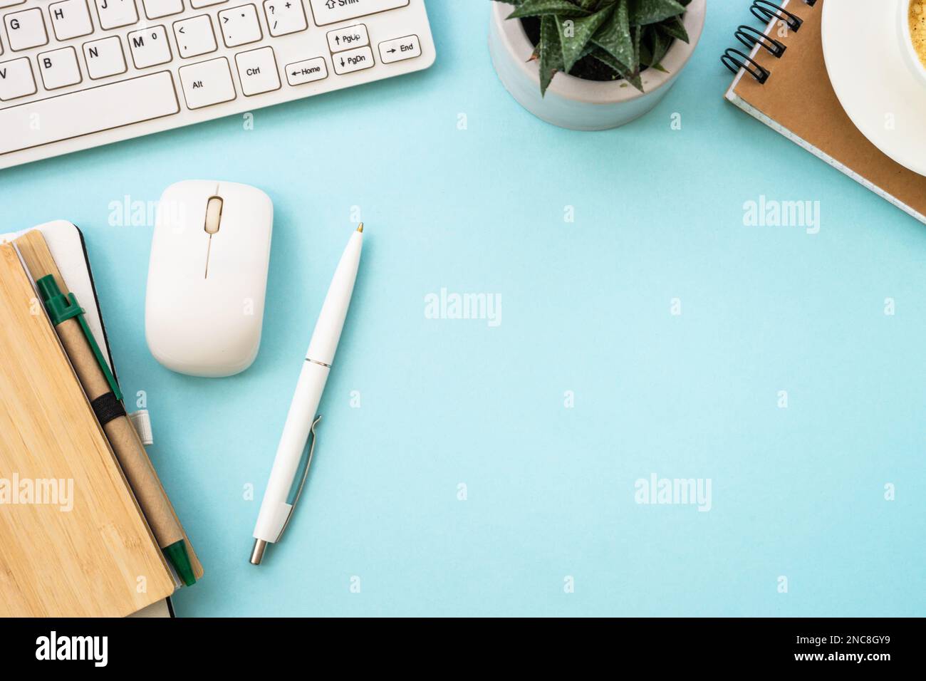 Office table desk with laptop, notepad and pen Stock Photo - Alamy