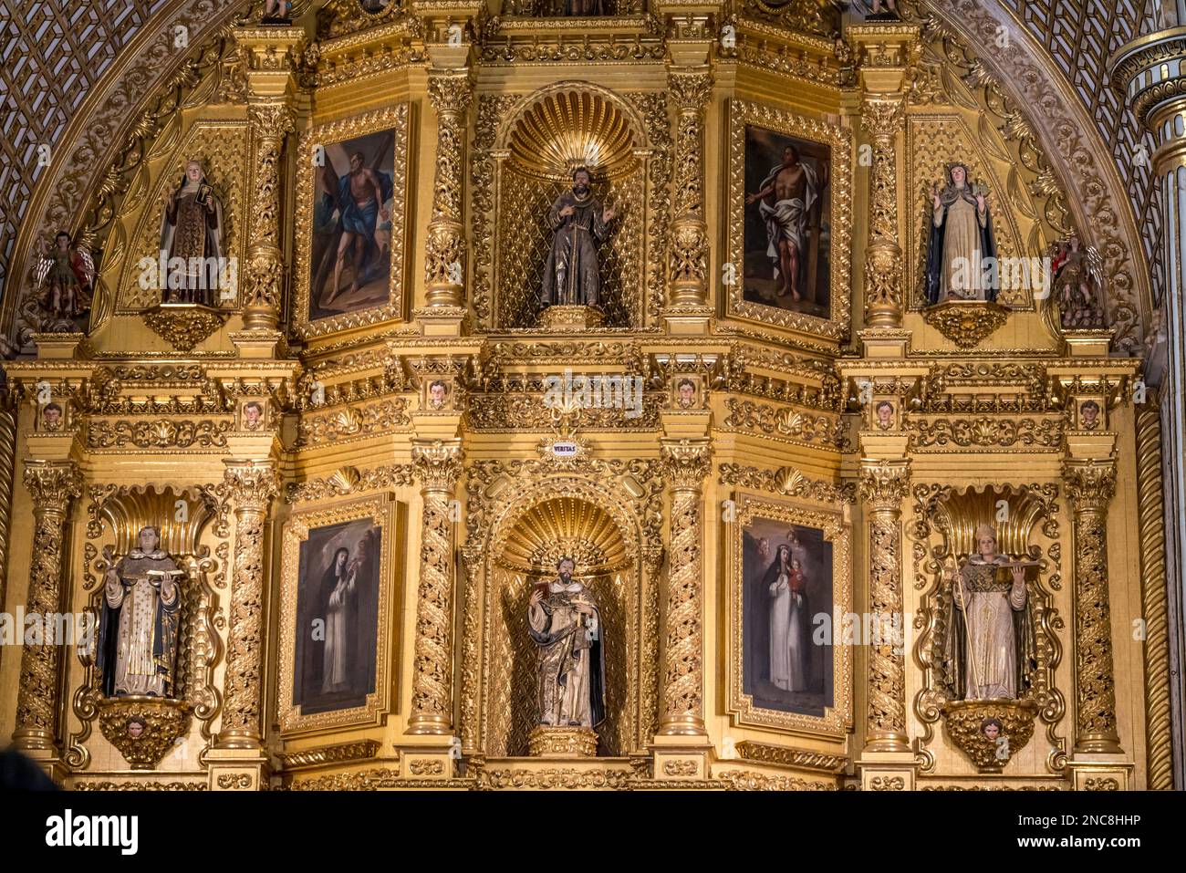 The golden altarpiece of the very ornate Church of Santo Domingo de Guzman in the historic ...