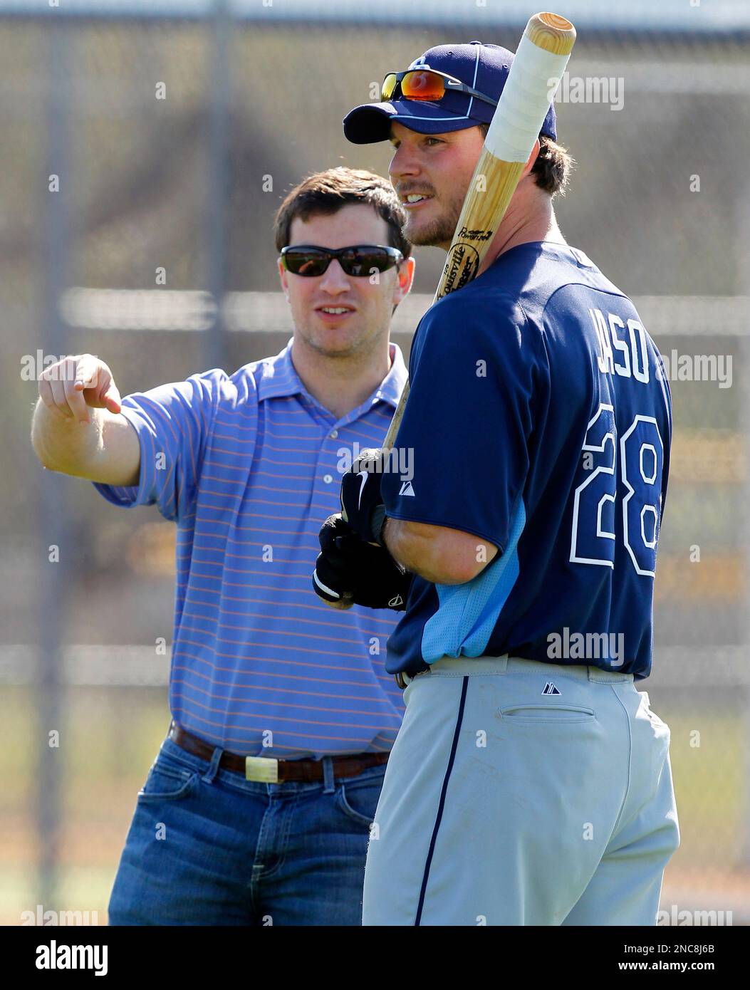 Tampa Bay Rays general manager Andrew Friedman, left, talks with ...