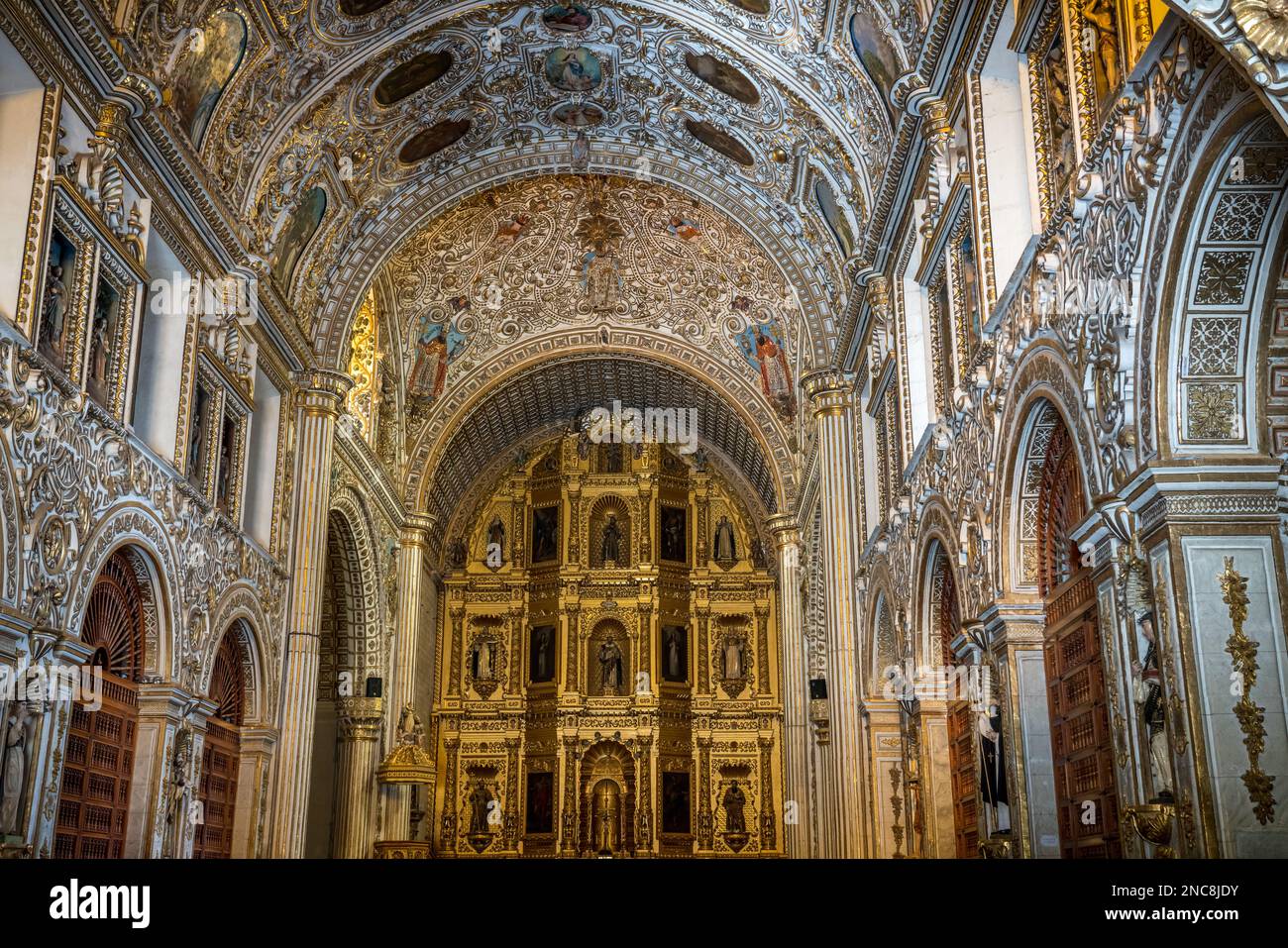 The very ornate interior of the Church of Santo Domingo de Guzman in ...