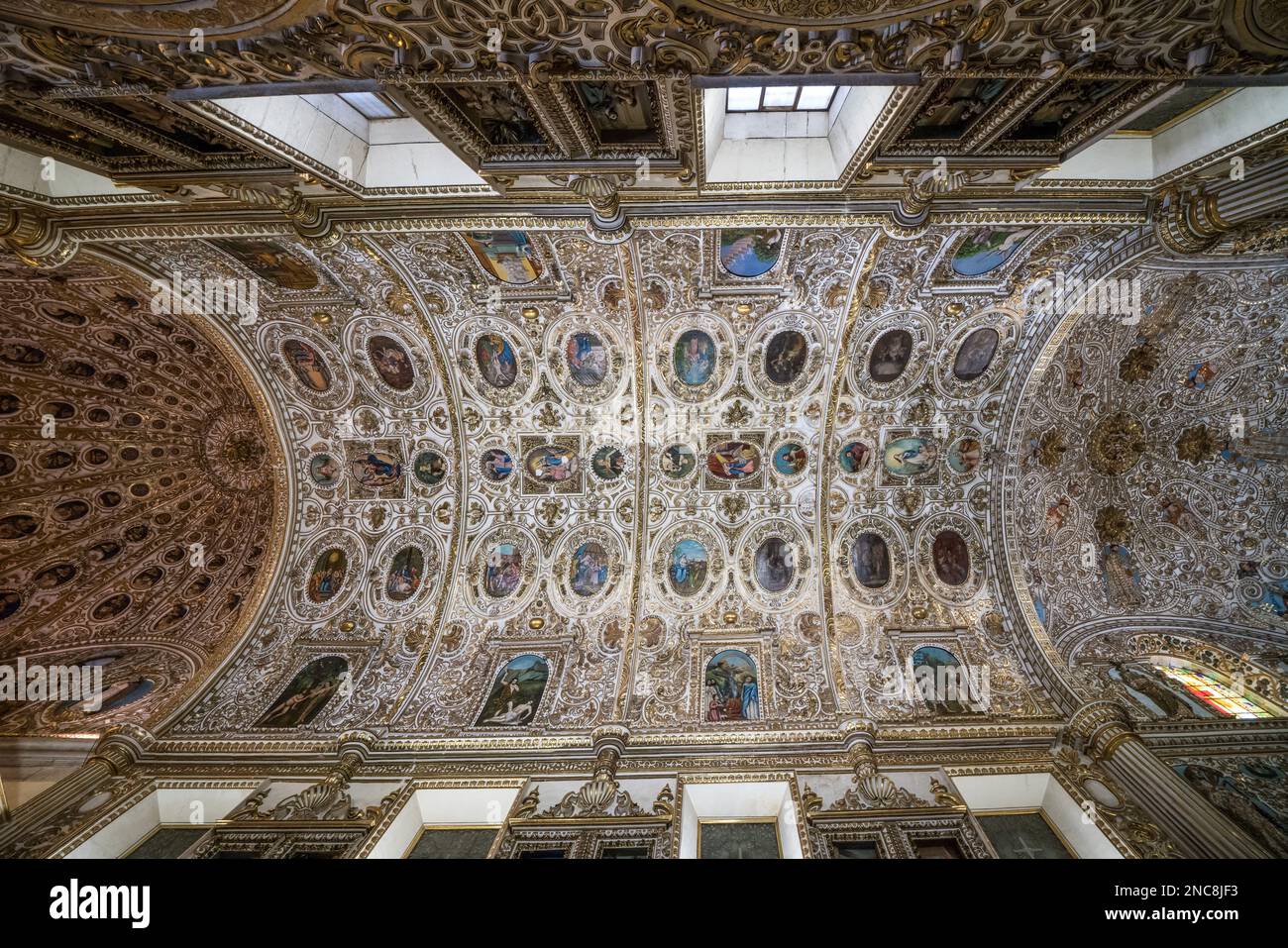 The barrel vault ceiling and interiors of the domes of the very ornate ...