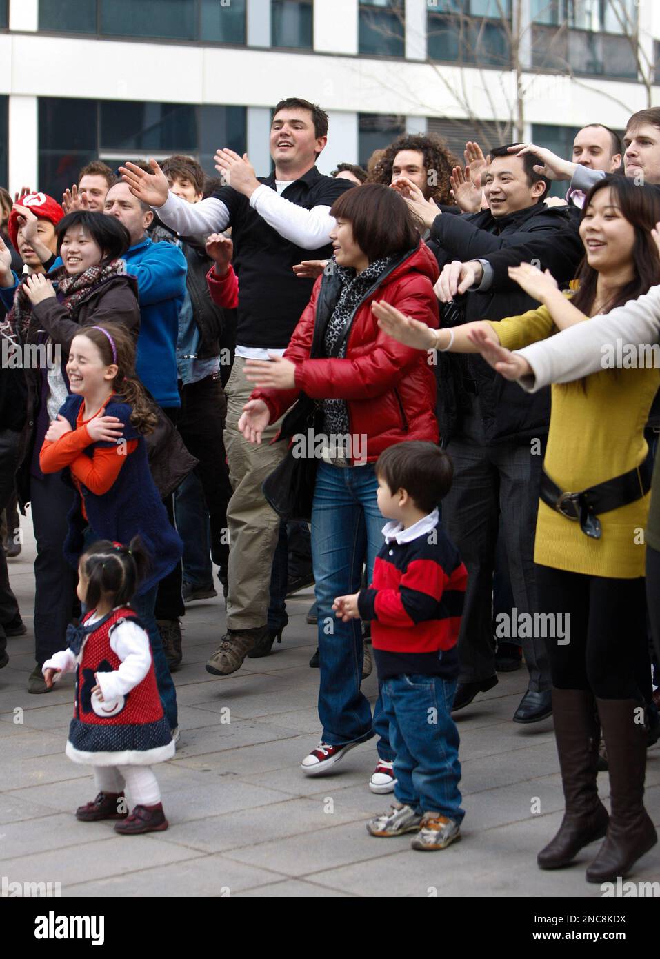 Matthew Harding of the U.S., center, performs dance with his fans and ...