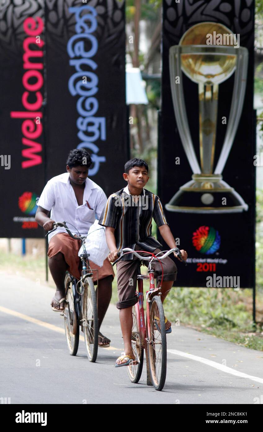 Sri Lankans ride past cutouts promoting the ICC Cricket World Cup in ...