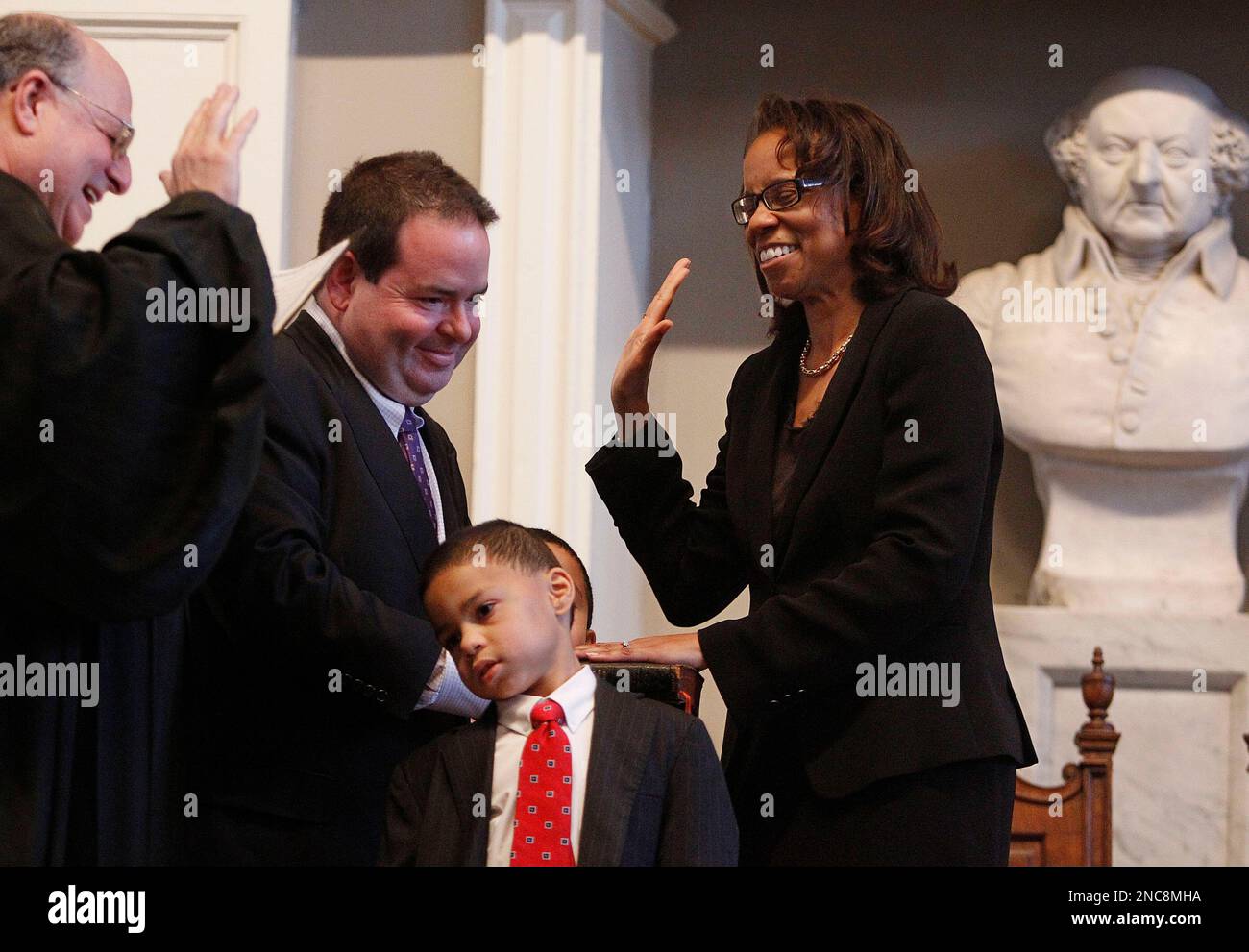 U.S. District Judge Denise Jefferson Casper takes the oath of office ...