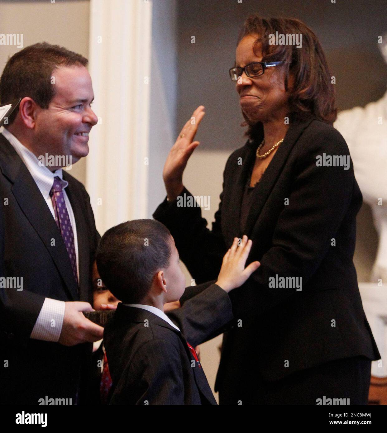 U.S. District Judge Denise Jefferson Casper takes the oath of office ...