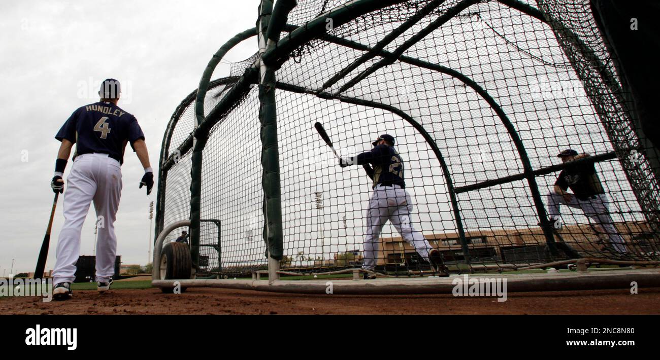 San Diego Padres catcher Gregg Zaun bats while catcher Nick Hundley (4 ...