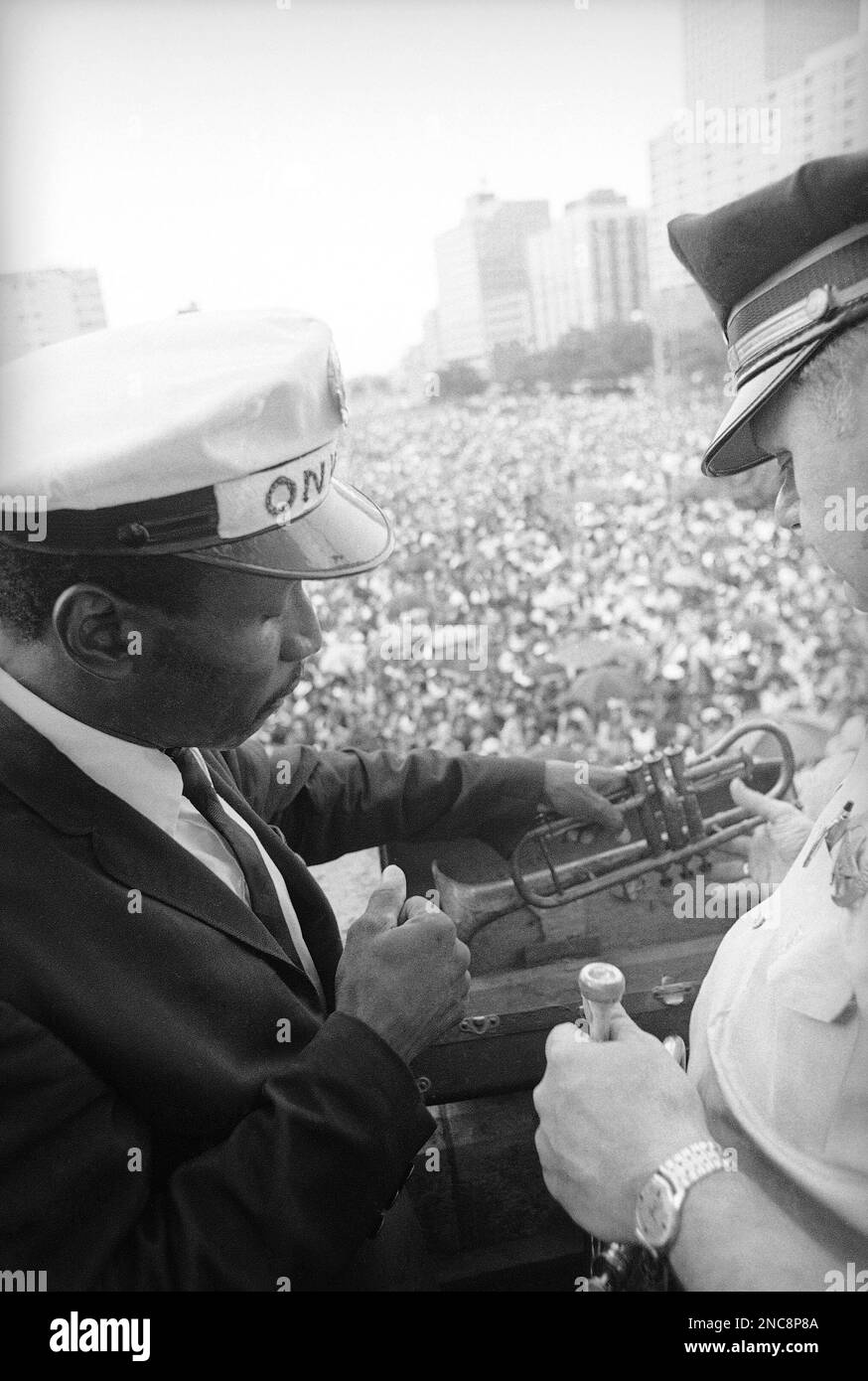 Theodore Riley, left, puts the first horn that Louis Armstrong ever ...