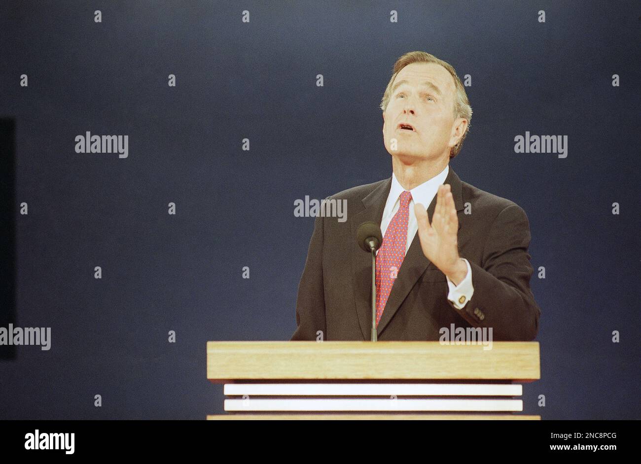 President George Bush looks up as he answers a question during ...