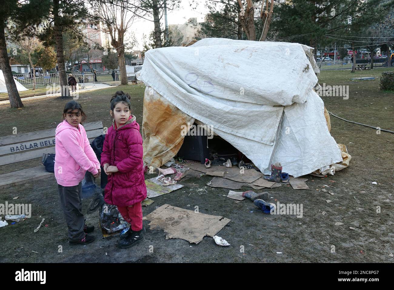 Children are seen outside their primitive set up of a tent following ...