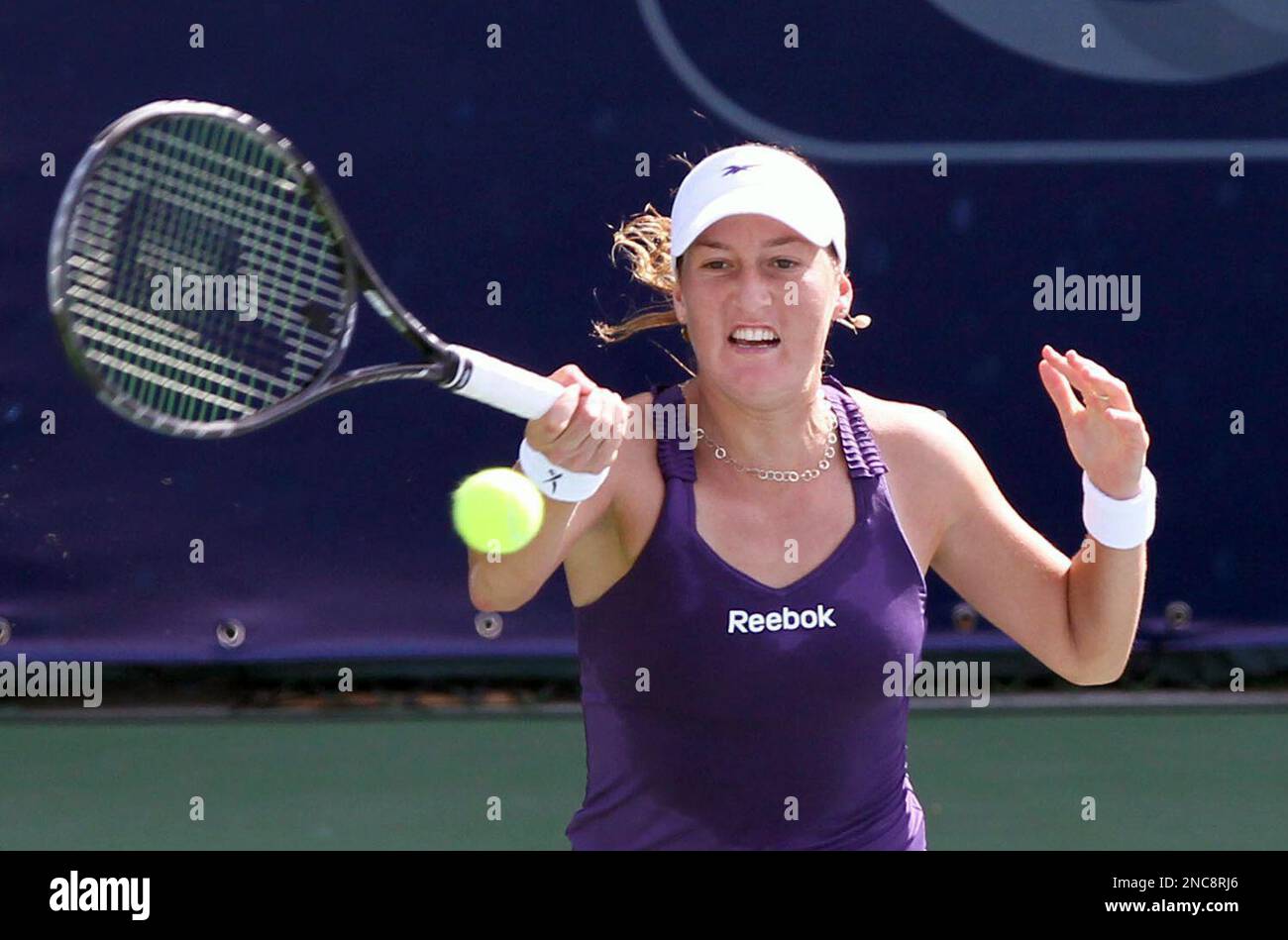 Israel's Shahar Peer returns the ball to Denmark's Caroline Wozniacki ...