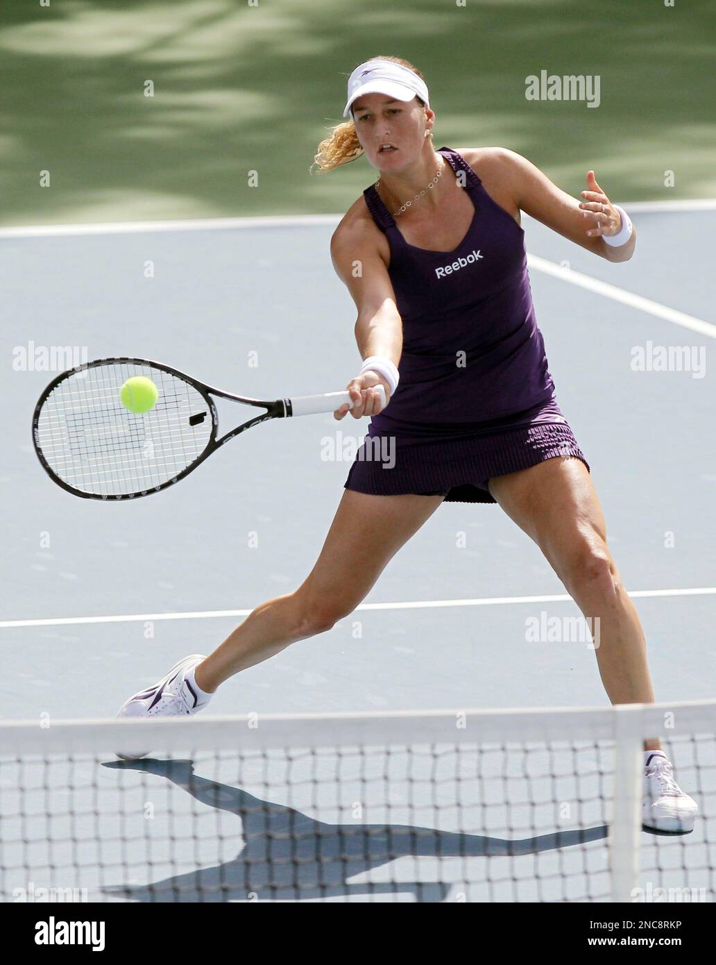 Israel's Shahar Peer returns the ball to Denmark's Caroline Wozniacki ...