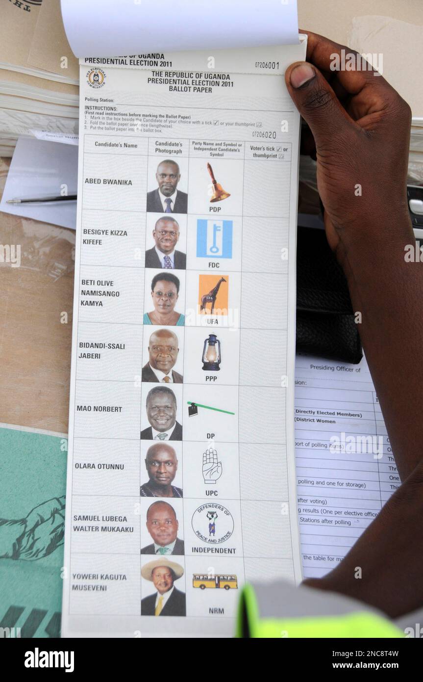 Uganda presidential elections ballot paper is held by election worker ...